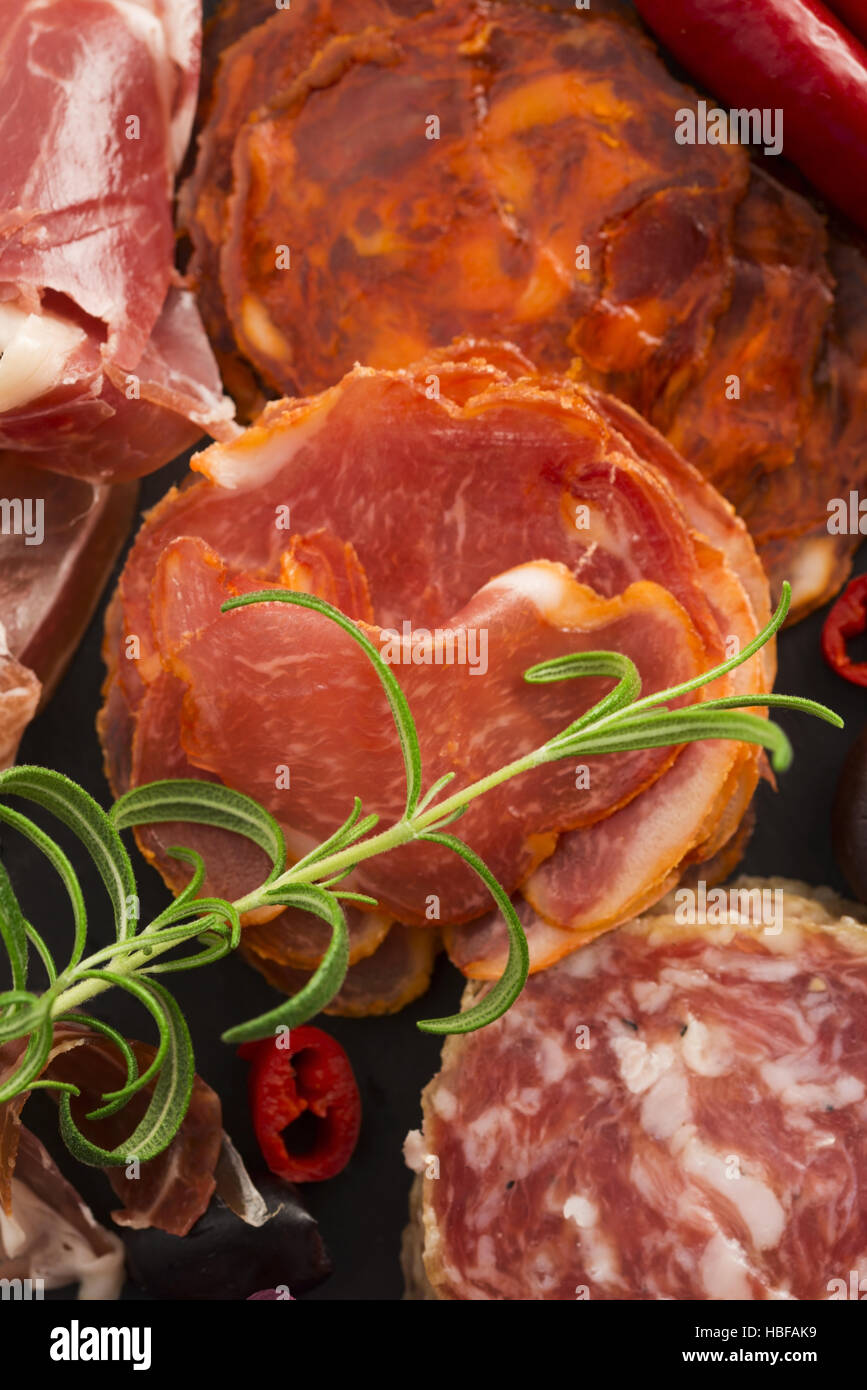 a pile of different spanish embutido, jamon, chorizo and lomo embuchado ...
