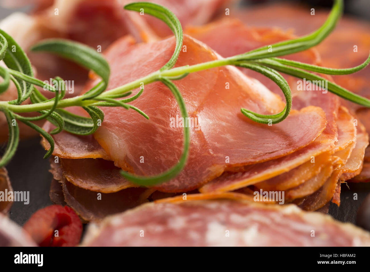 a pile of different spanish embutido, jamon, chorizo and lomo embuchado ...