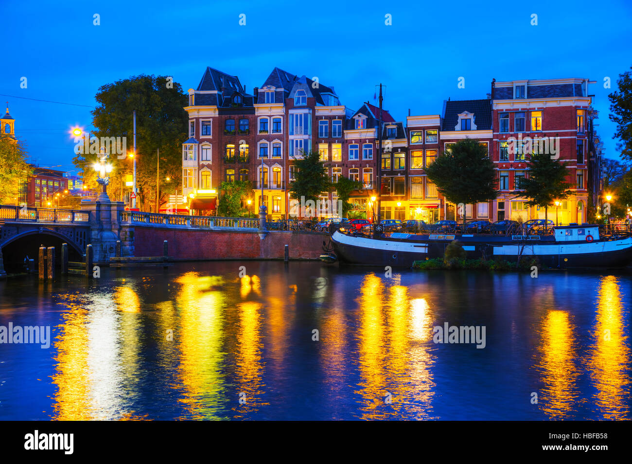 Amsterdam city view with Amstel river at sunset Stock Photo - Alamy