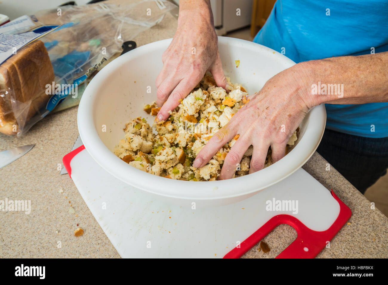 woman making turkey stuffing for thanksgiving Stock Photo - Alamy