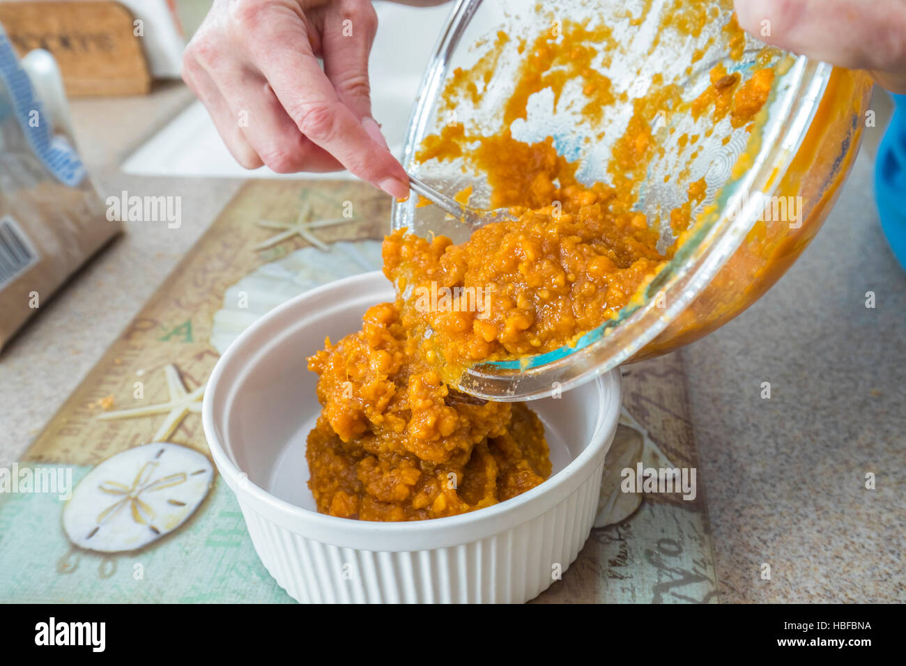 woman making yam walnut casserole for thanksgiving Stock Photo - Alamy