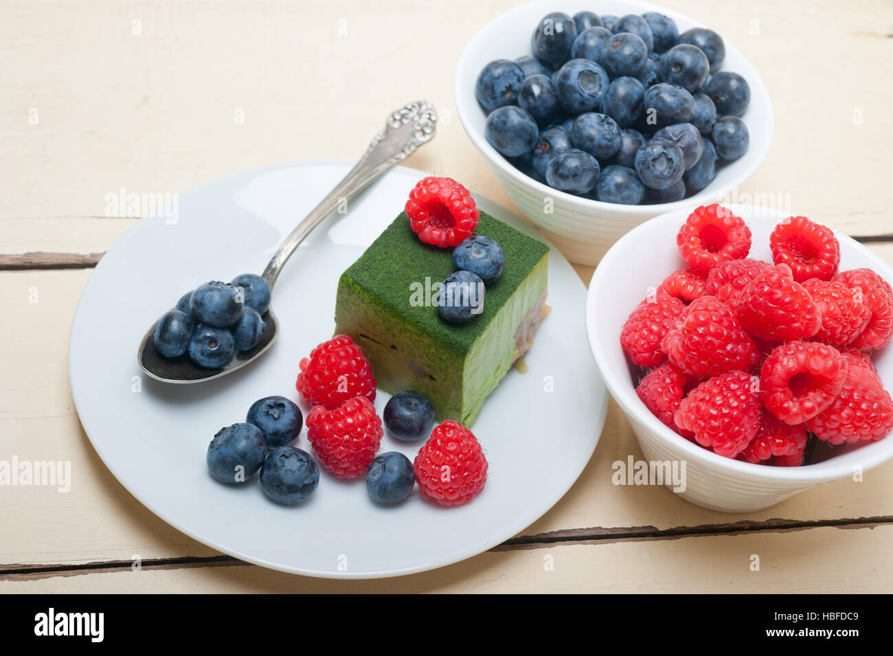 green tea matcha mousse cake with berries Stock Photo - Alamy