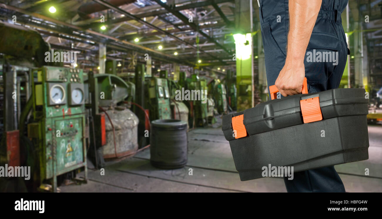 Worker with instruments Stock Photo - Alamy