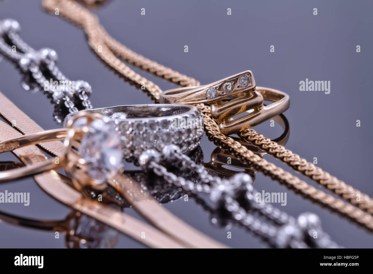 gold ring, earrings and chains Stock Photo - Alamy