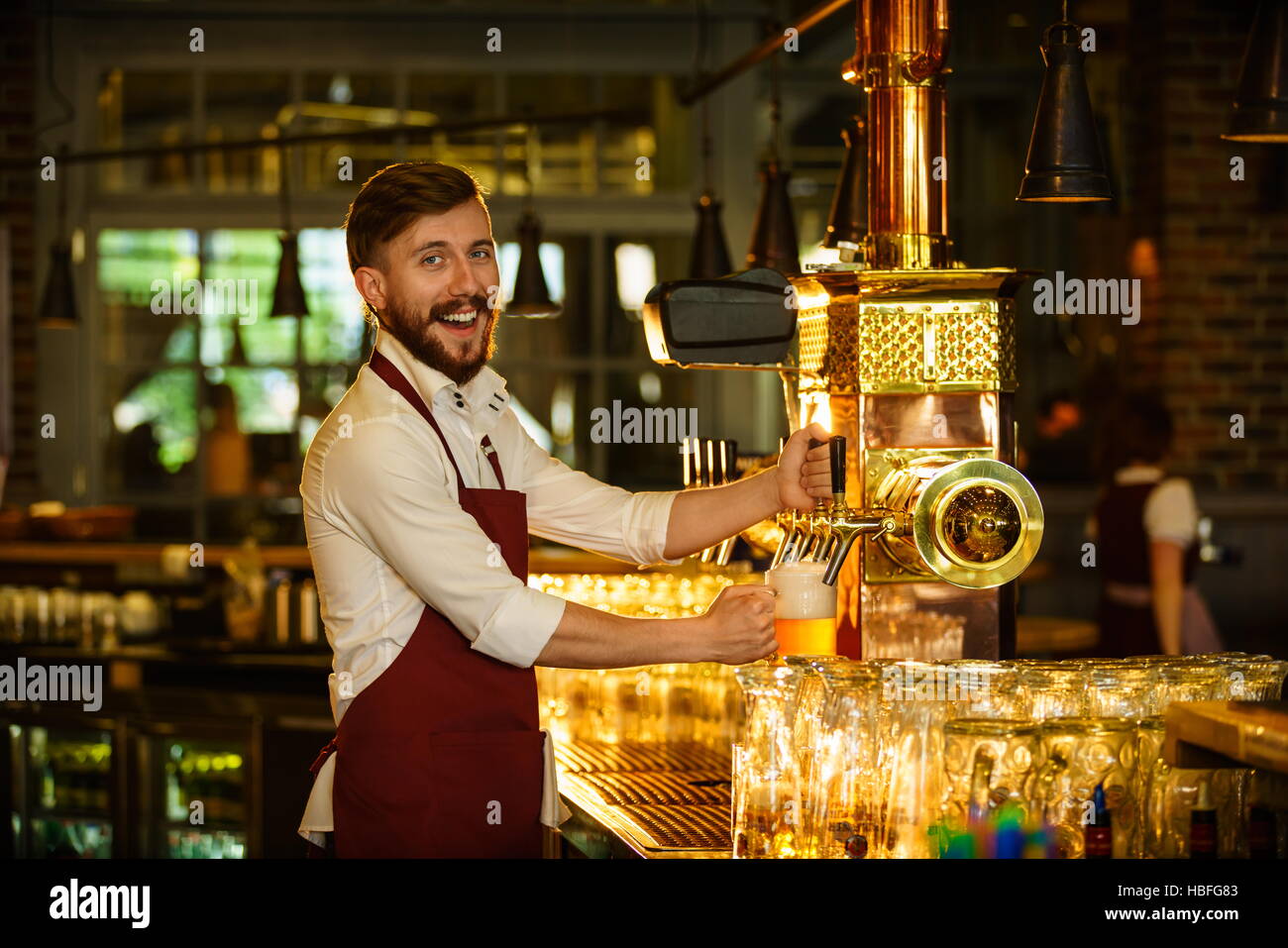 Man pouring pint hi-res stock photography and images - Alamy
