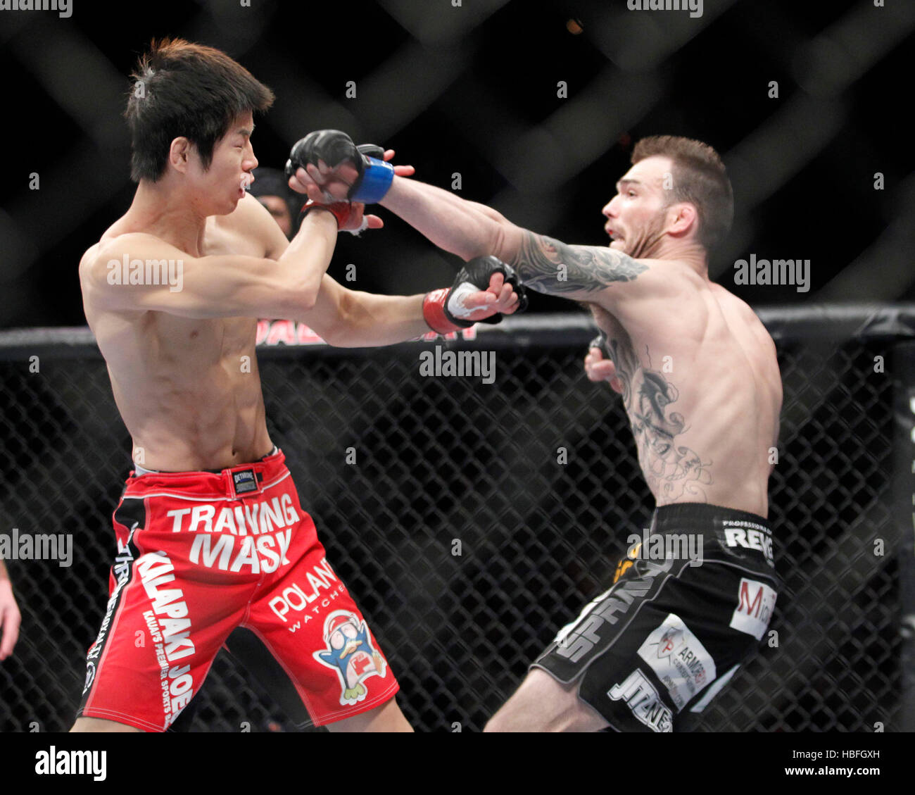 Hatsu Hioki, left, trades punches with George Roop during UFC 137 at ...