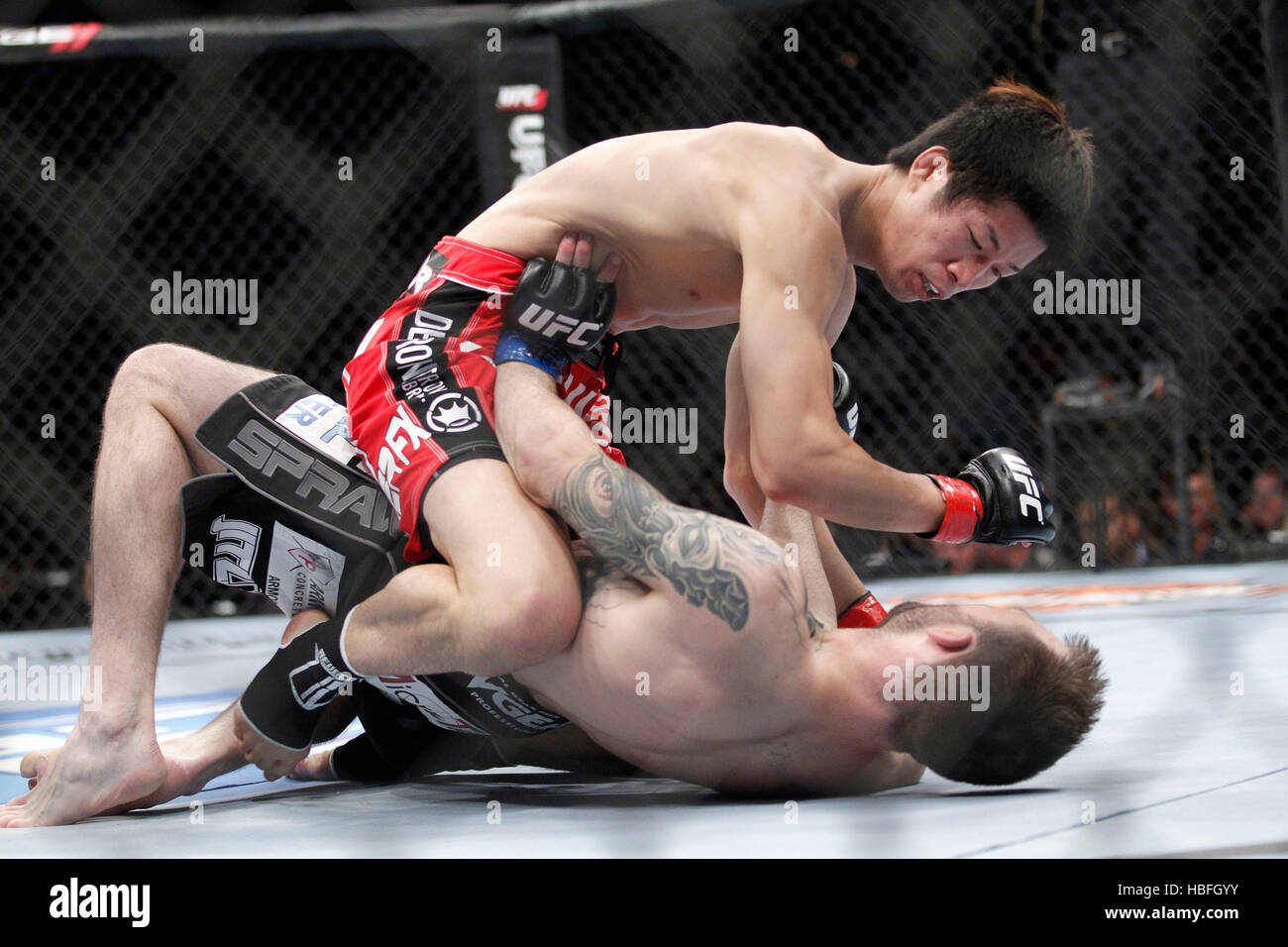 Hatsu Hioki, top punches George Roop during UFC 137 at the Mandalay ...