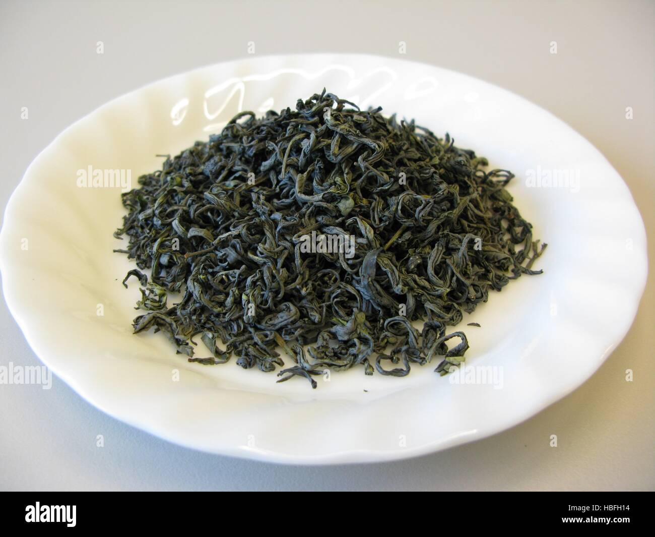 Green tea on dish Stock Photo - Alamy