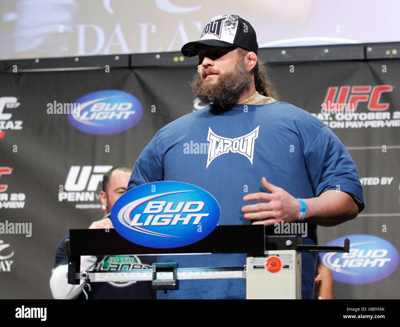 UFC fighter Roy Nelson wears a fat suit during a weigh-in for UFC 137 ...