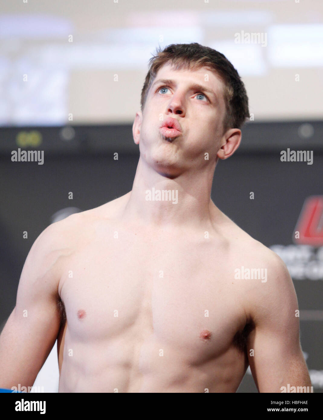 UFC fighter Danny Downes on the scale during a weigh-in for UFC 137 in ...