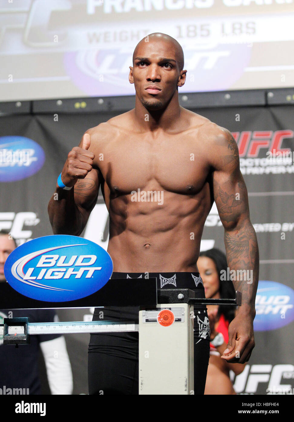 UFC fighter Francis Carmont on the scale during a weigh-in for UFC 137 ...