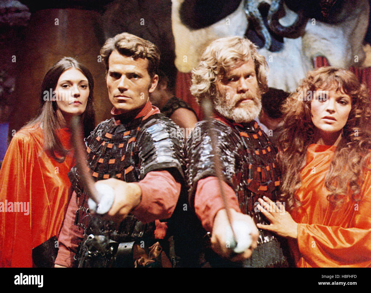 THE PEOPLE THAT TIME FORGOT, from left: Sarah Douglas, Patrick Wayne ...