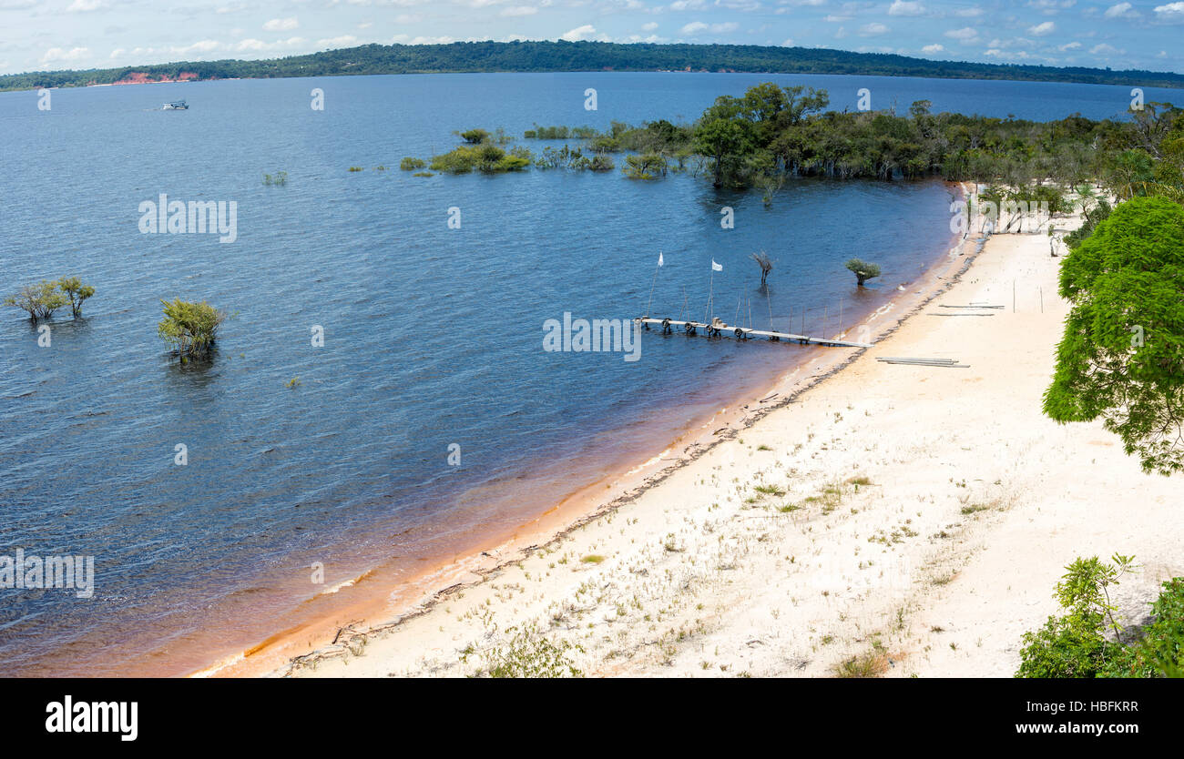 Wooden pier and sand beach on the Amazon River in Manaus, Brazil Stock ...