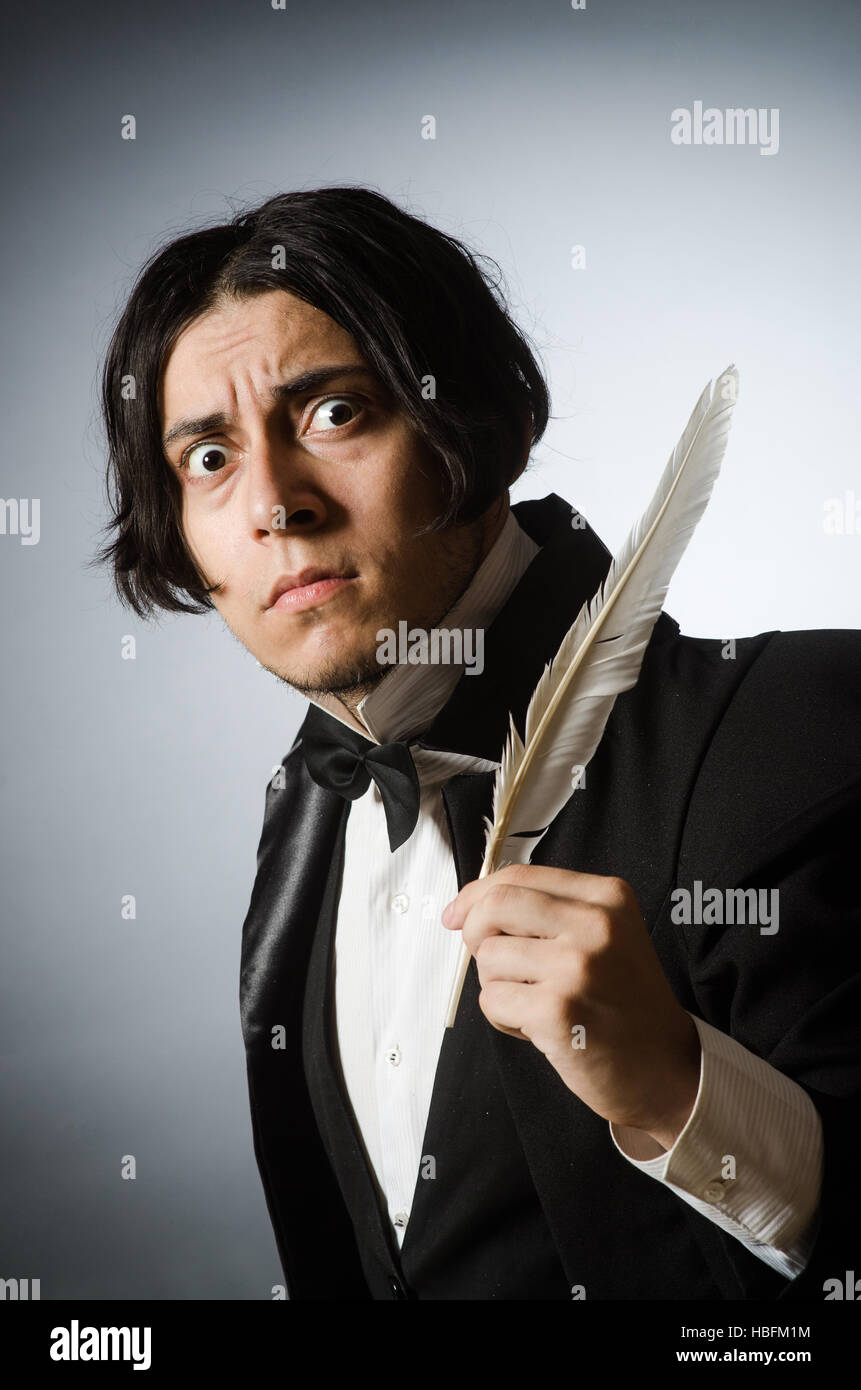 Funny writer with quill in vintage concept Stock Photo - Alamy