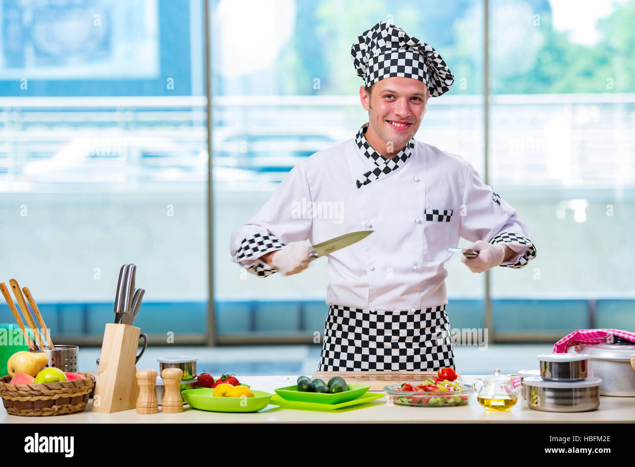 Male cook preparing food in the kitchen Stock Photo - Alamy