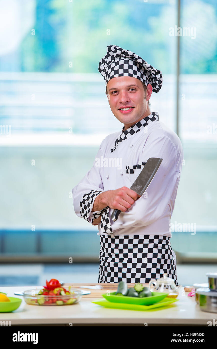 Male cook preparing food in the kitchen Stock Photo - Alamy