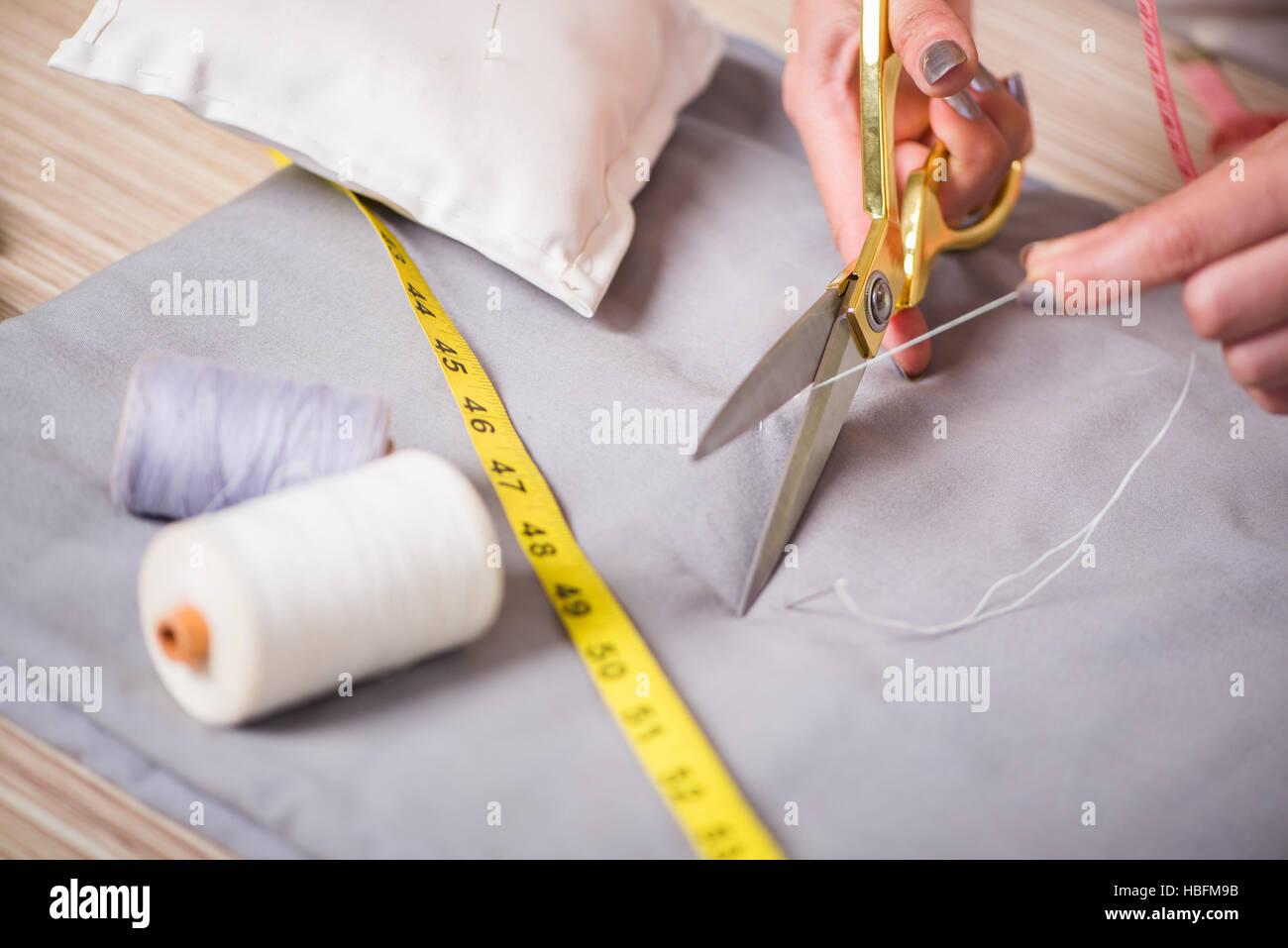 Tailor hands working on new clothing Stock Photo - Alamy