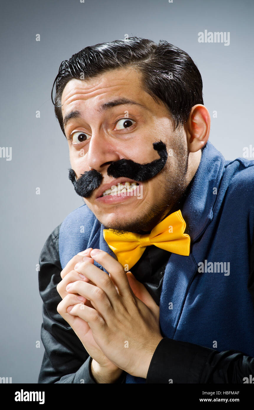 Funny man against dark background Stock Photo - Alamy