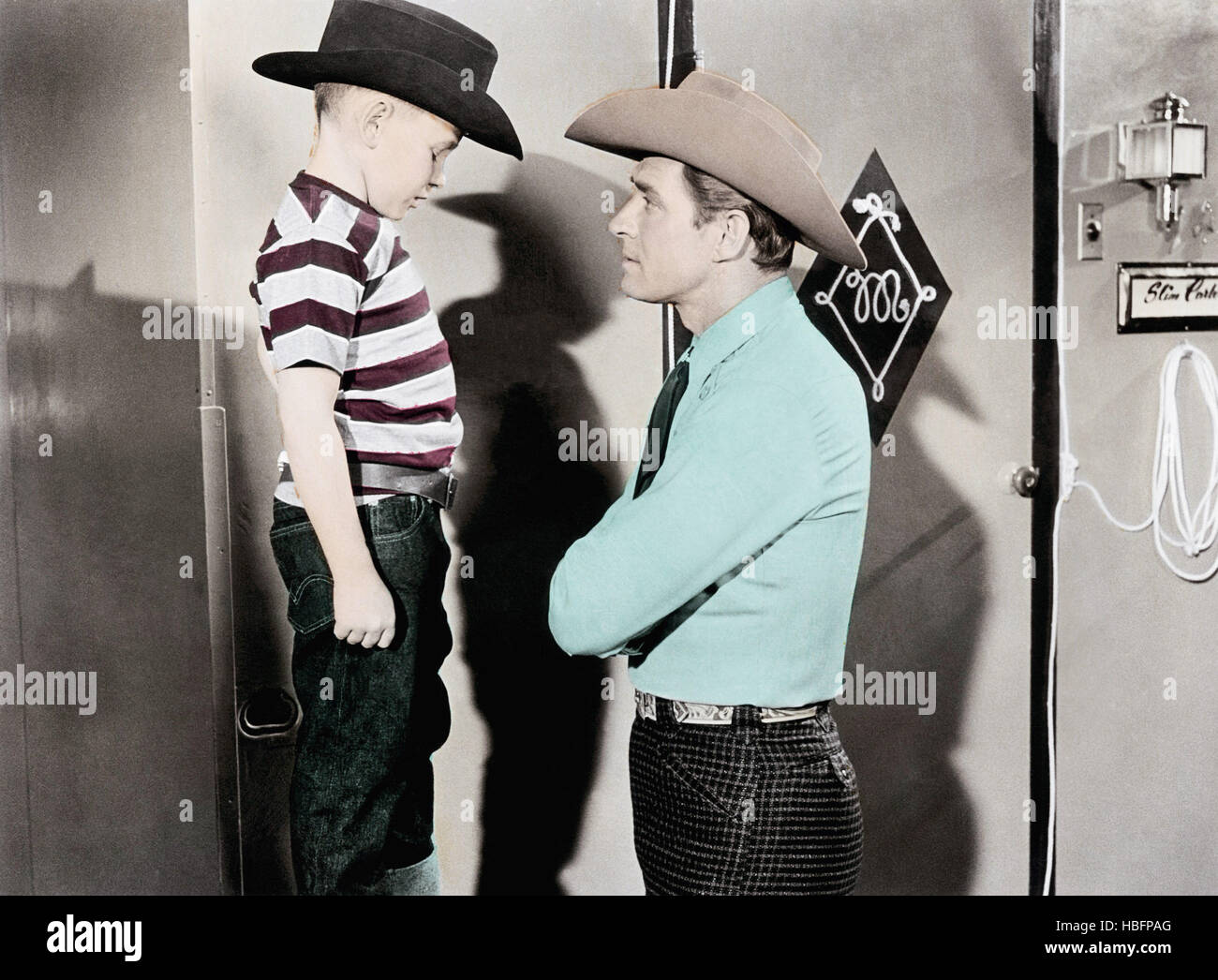 SLIM CARTER, from left, Tim Hovey, Jock Mahoney, 1957 Stock Photo - Alamy