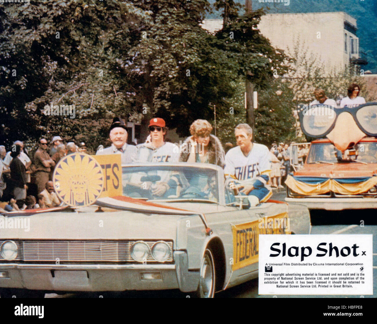 SLAP SHOT, riding in front car from left: Strother Martin, Michael ...
