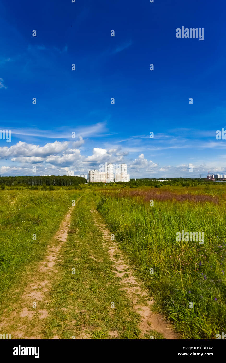 landscape road footpath through a field Stock Photo - Alamy