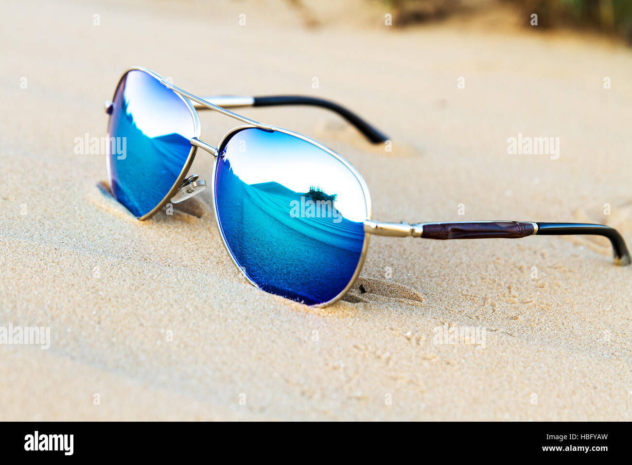 Sunglasses on the sand in the desert Stock Photo - Alamy