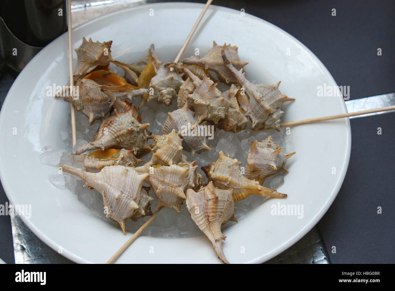 A plate of snails on ice Stock Photo - Alamy