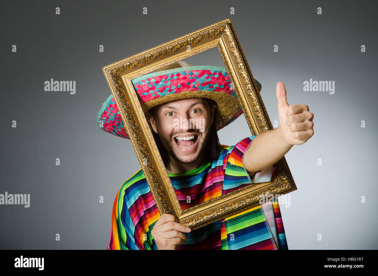 Funny man with sombrero and picture frame Stock Photo - Alamy