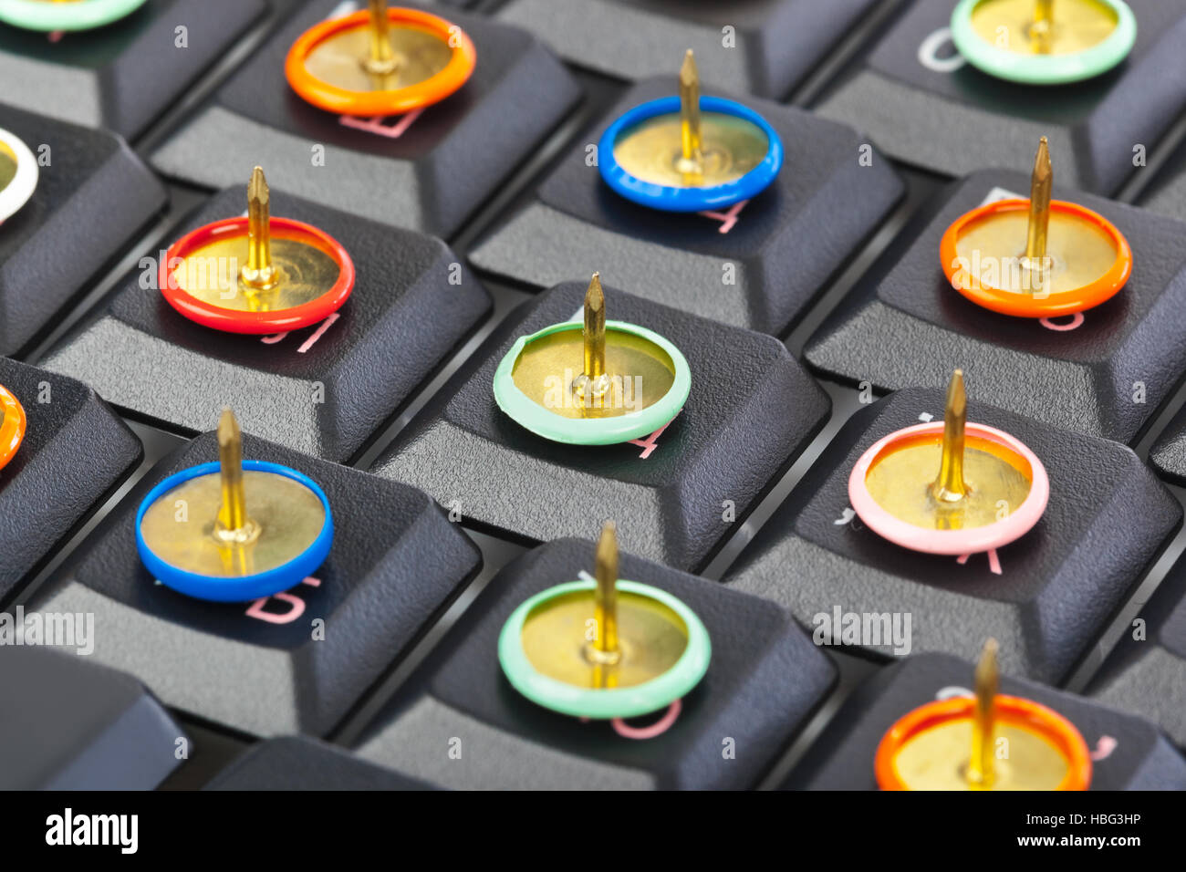 Pins on computer keyboard Stock Photo - Alamy