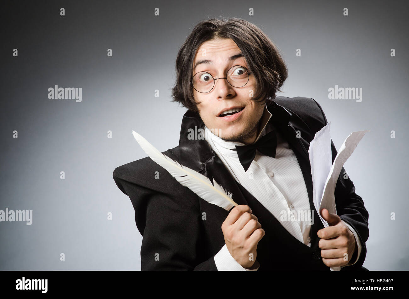 Funny writer with quill in vintage concept Stock Photo - Alamy