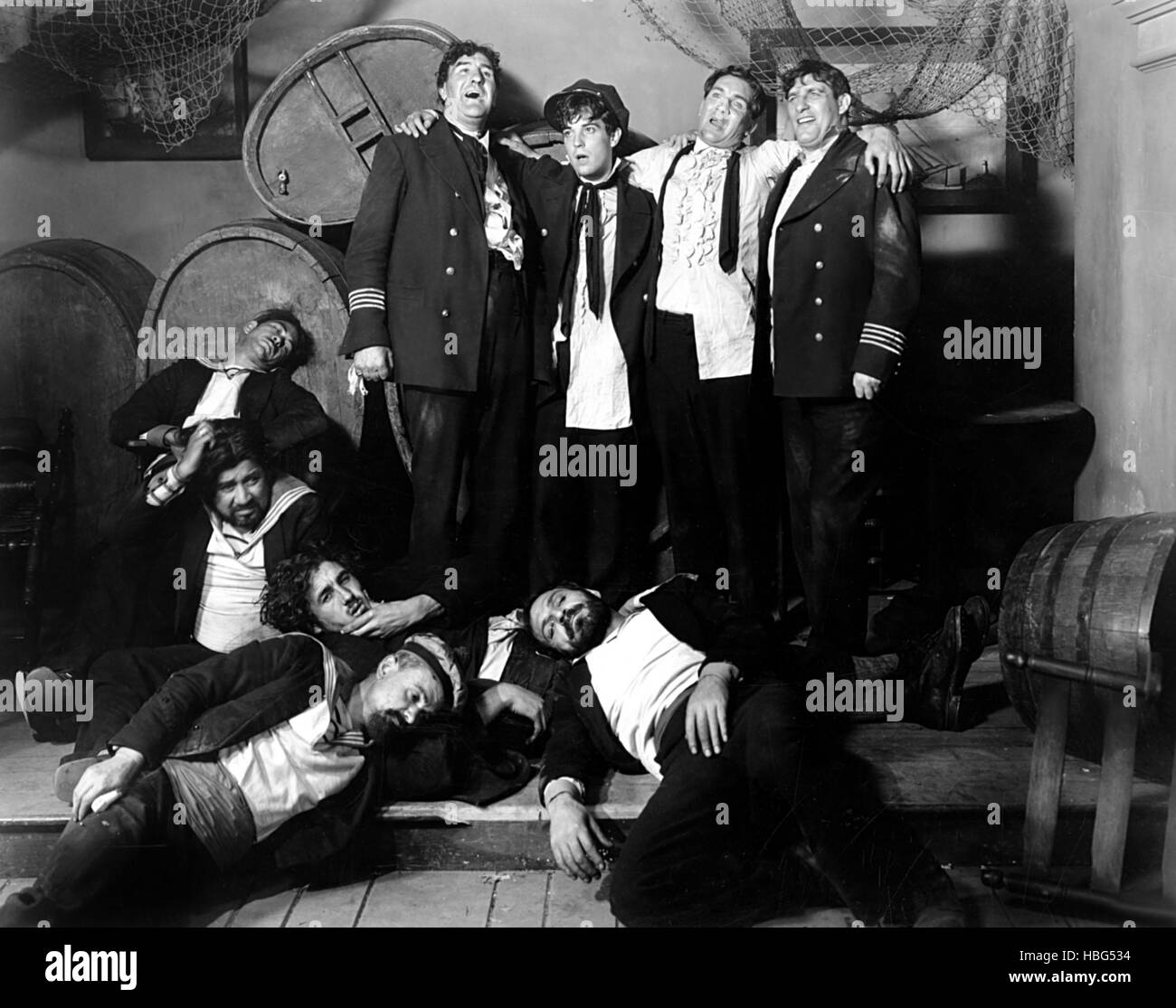ACROSS TO SINGAPORE, standing from left: Ernest Torrence, Ramon Novarro ...