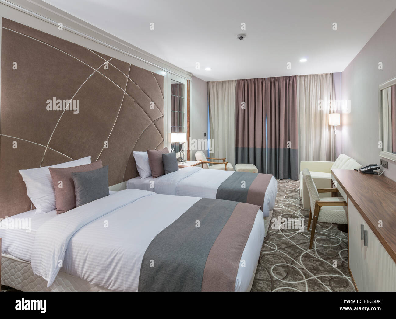 Modern hotel room with big bed Stock Photo - Alamy