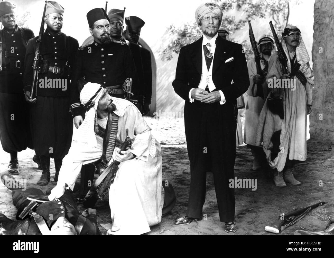 ADVENTURE IN IRAQ, Paul Cavanagh (center, in turban), 1943 Stock Photo ...