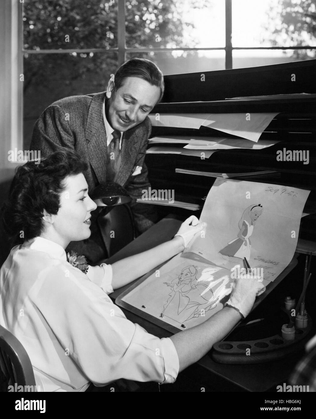 ALICE IN WONDERLAND, producer Walt Disney (rear) visiting the ink and ...