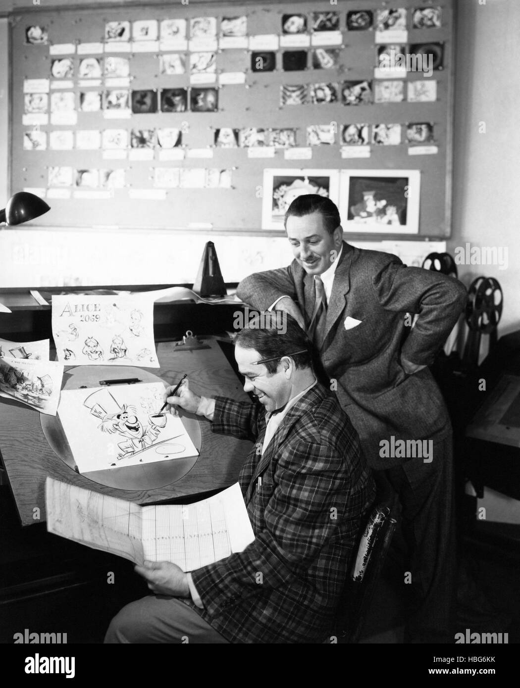 ALICE IN WONDERLAND, from left: animator Ward Kimball works on a ...