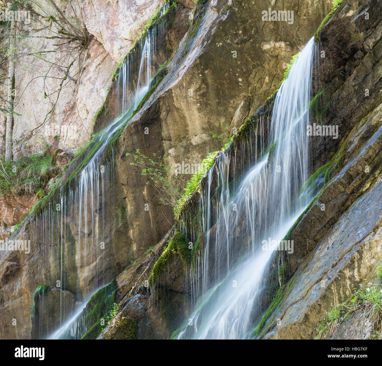 Waterfall on mossy slope in gorge, Wimbachklamm, Wimbachtal, Ramsau bei ...