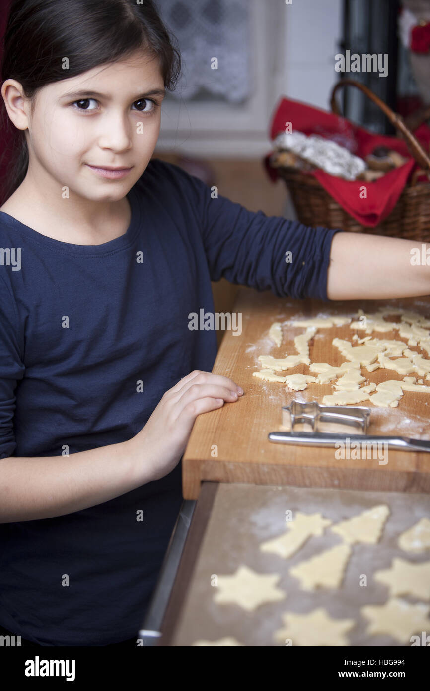 Young girl is baking christmas cookies Stock Photo - Alamy