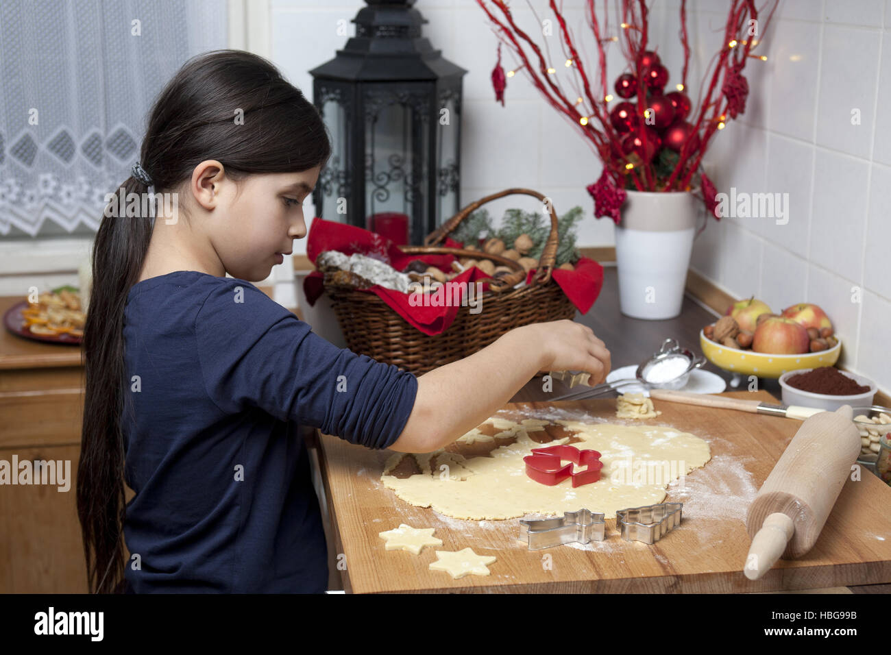 Young girl is baking christmas cookies Stock Photo - Alamy