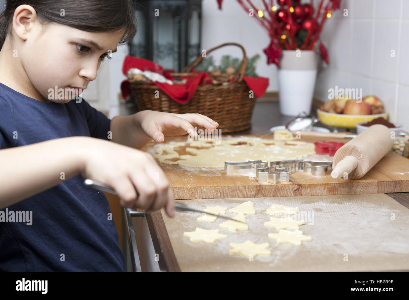 Young girl is baking christmas cookies Stock Photo - Alamy