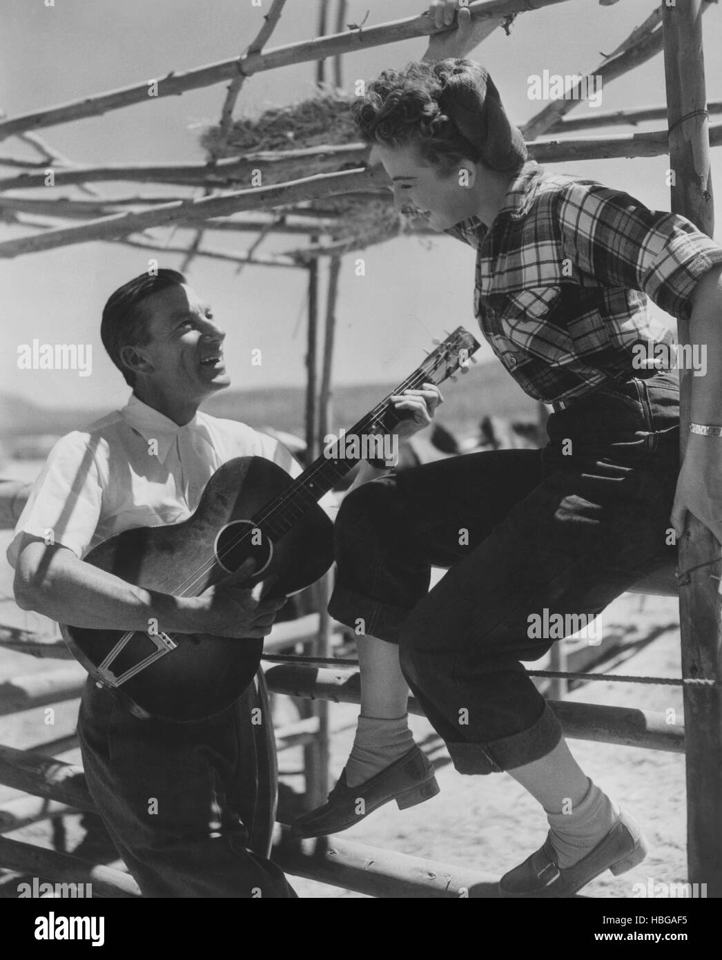 APACHE DRUMS, visitor Hoagy Carmichael serenading Coleen Gray on set ...