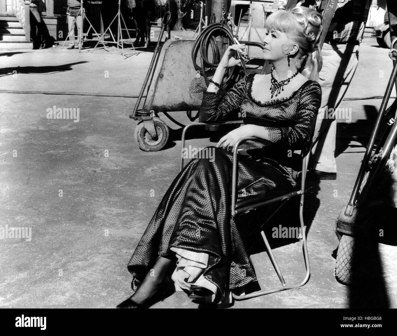ARIZONA BUSHWHACKERS, Marilyn Maxwell, catching a smoke between takes ...