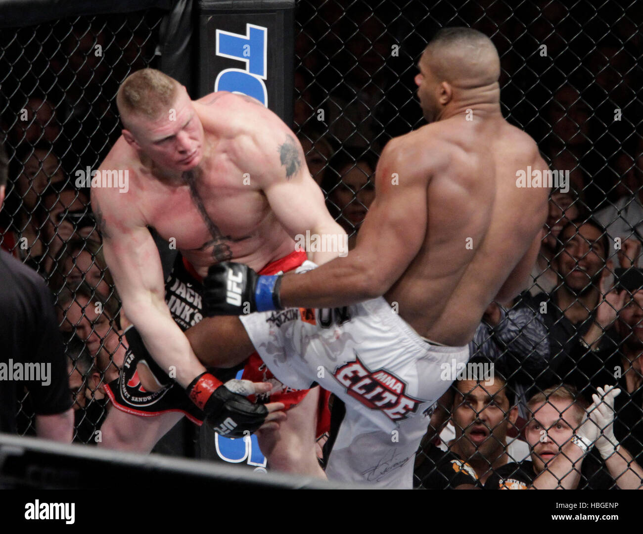 UFC fighter Alistair Overeem, right, kicks Brock Lesnar at UFC 141 at ...