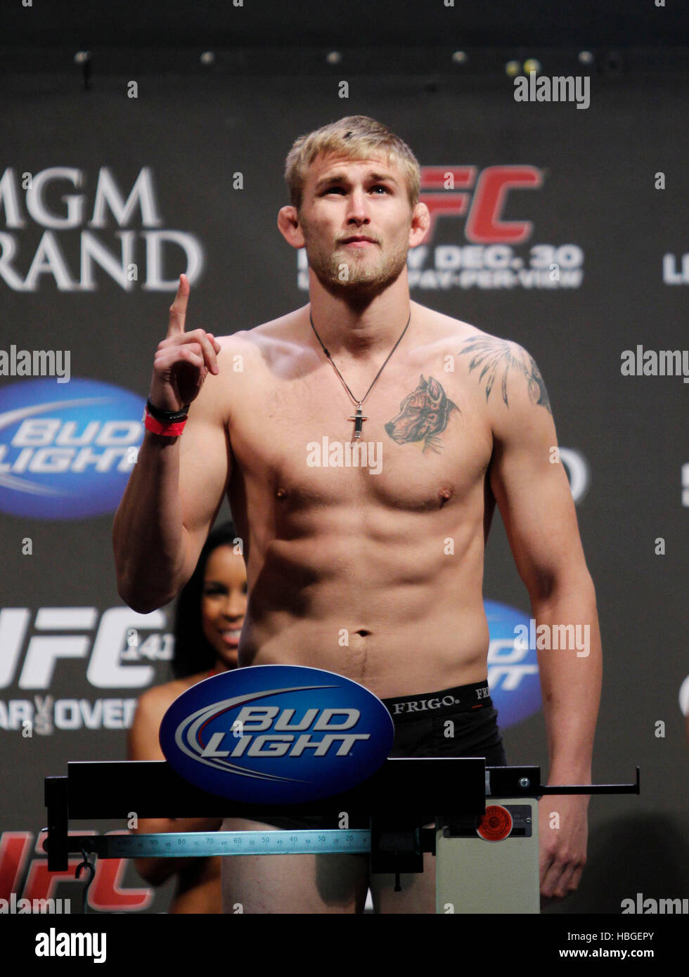UFC fighter Alexander Gustafsson steps on the scale at the weigh-ins ...