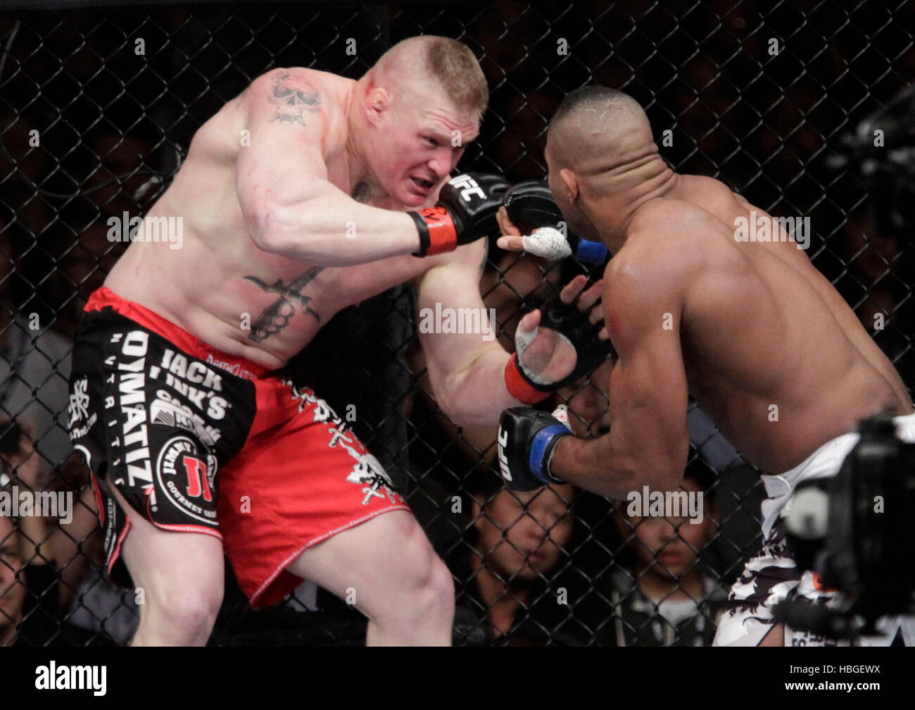 UFC fighters Brock Lesnar, left, and Alistair Overeem fight at UFC 141 ...