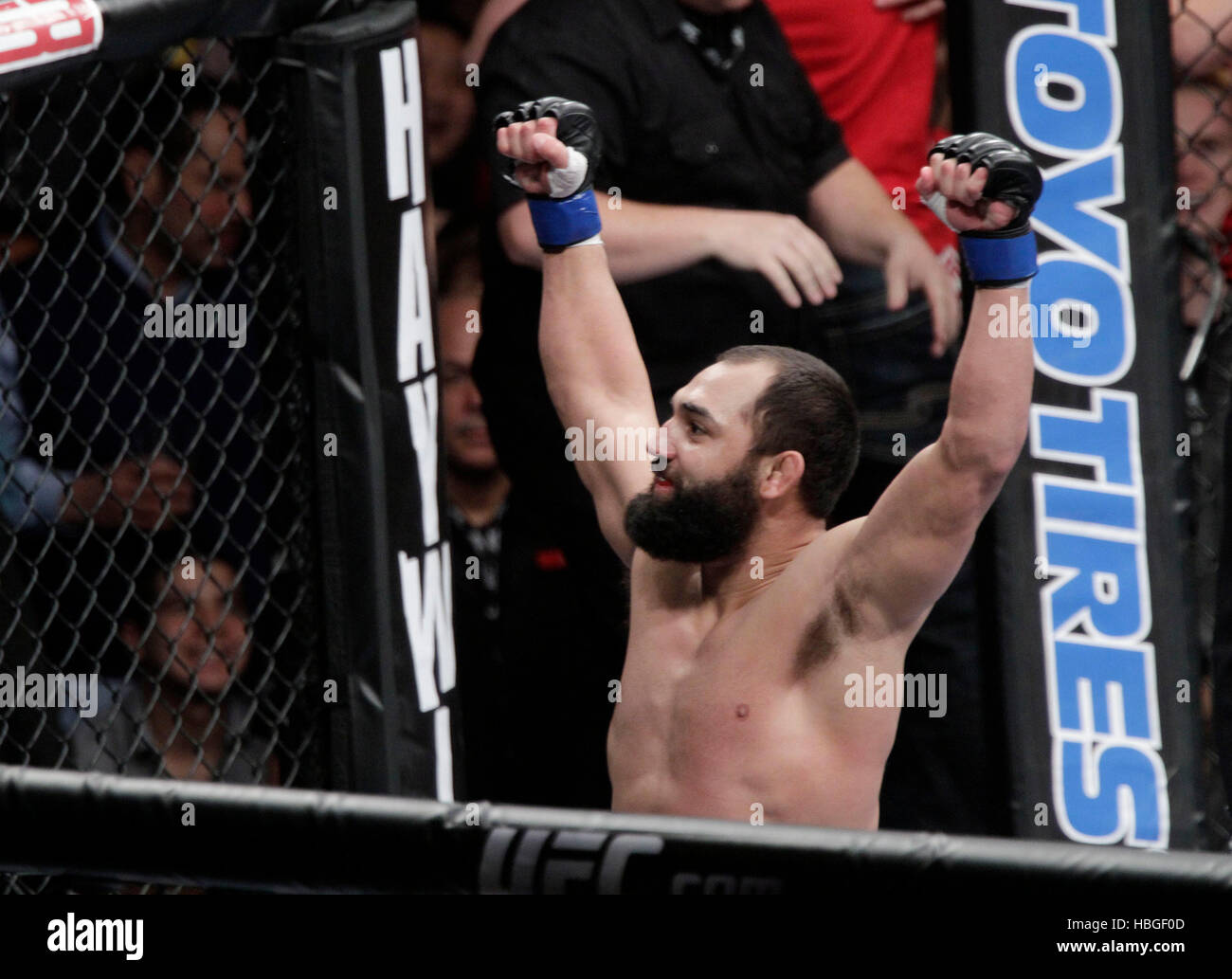 UFC fighter Johny Hendricks celebrates his victory over Jon Fitch at ...