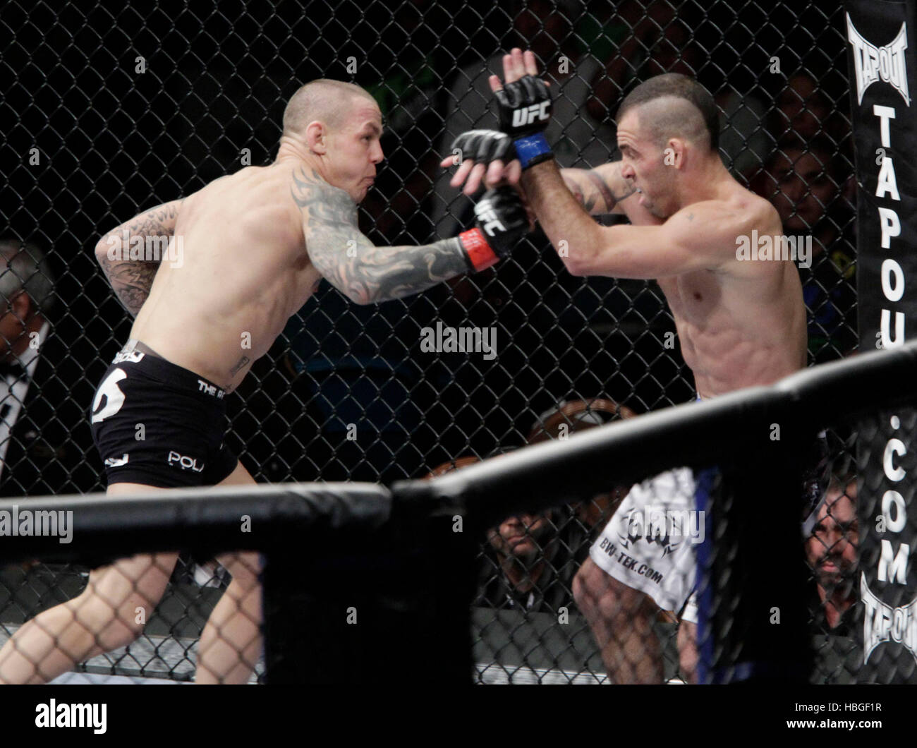 UFC fighter Ross Pearson, left, fights Junior Assuncao at UFC 141 at ...