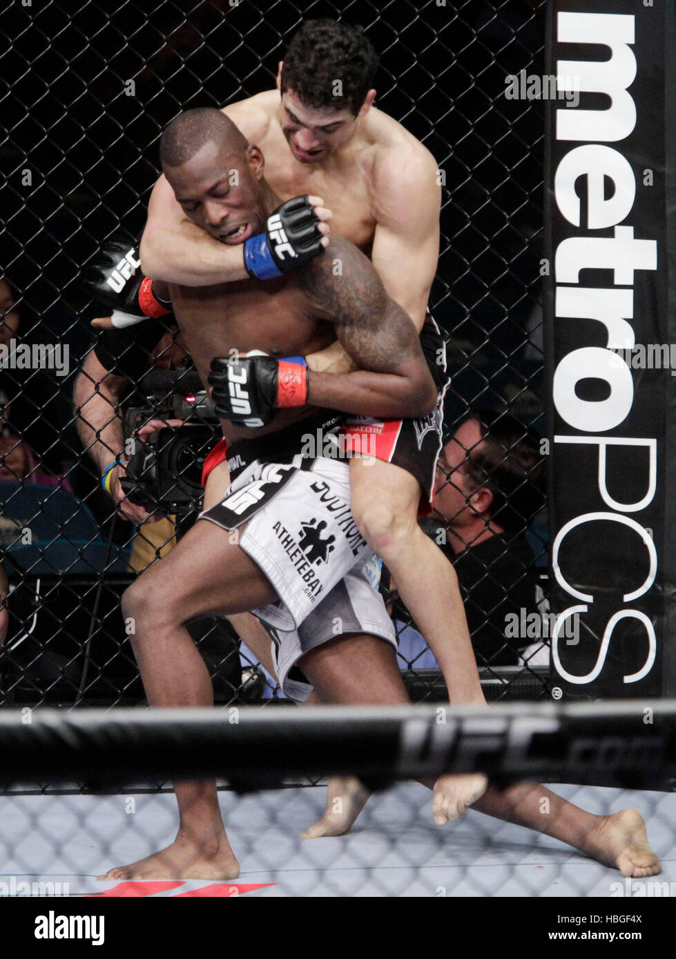 UFC fighter Danny Castillo, right, fights Anthony Njokuani at UFC 141 ...