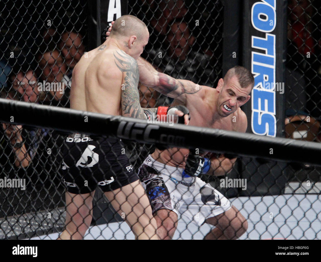 UFC fighter Ross Pearson, left, fights Junior Assuncao at UFC 141 at ...