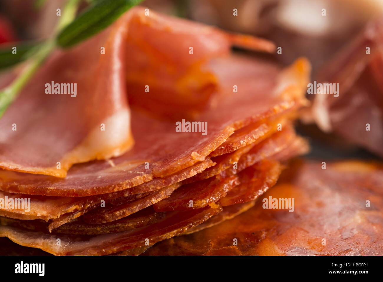 a pile of different spanish embutido, jamon, chorizo and lomo embuchado ...