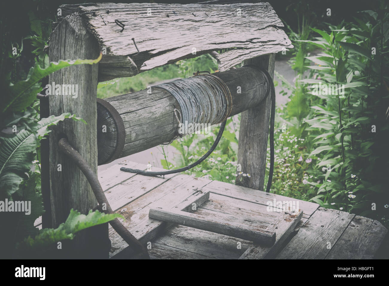 Old village style. The well water Stock Photo - Alamy